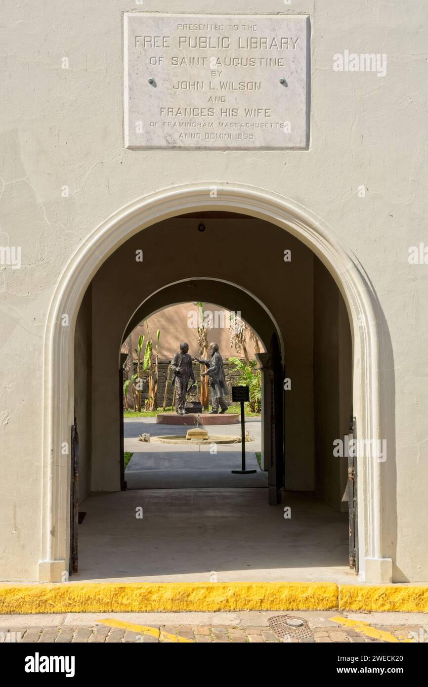 Archway entrance to courtyard with Sons of St Augustine statue in 18th ...