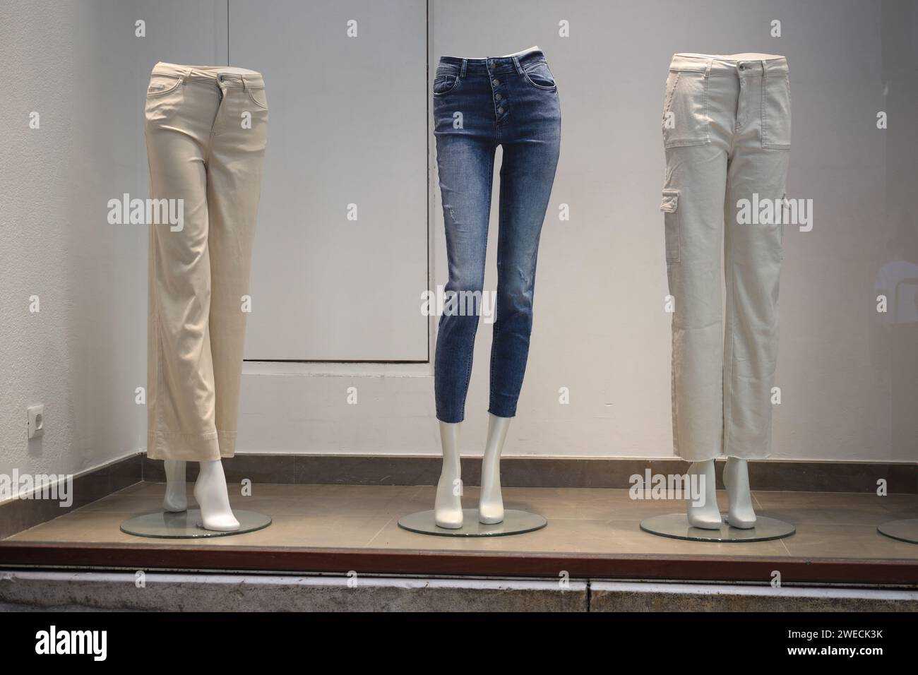 Shop display with mannequins in stylish pants Stock Photo - Alamy