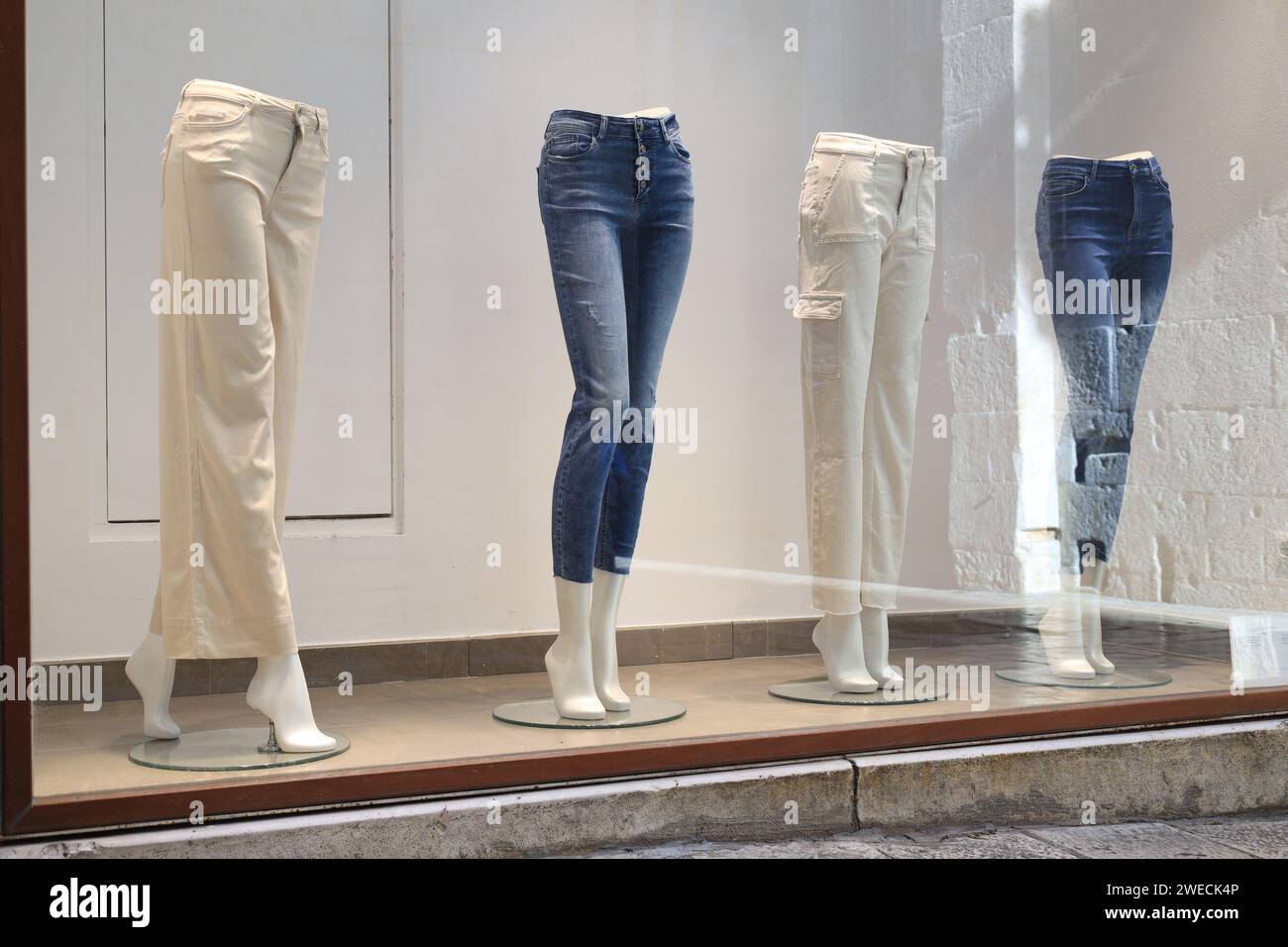 Shop display with mannequins in stylish pants Stock Photo - Alamy