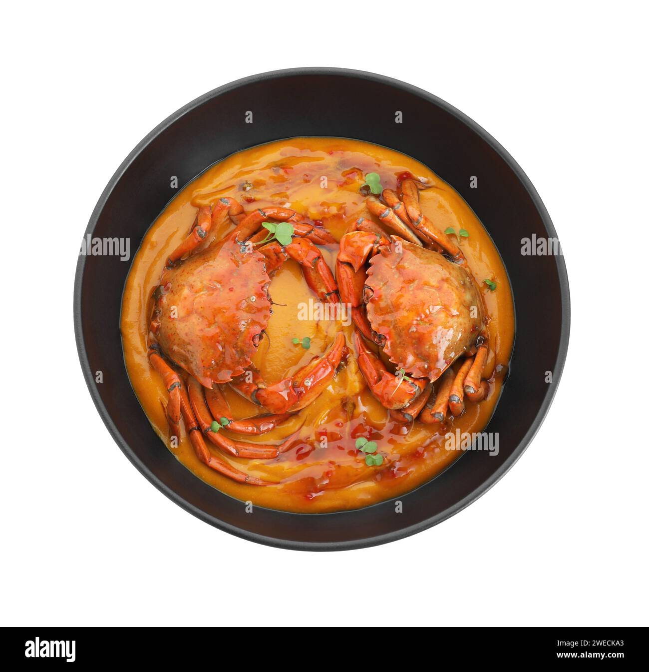 Delicious boiled crabs with sauce in bowl isolated on white, top view Stock Photo - Alamy