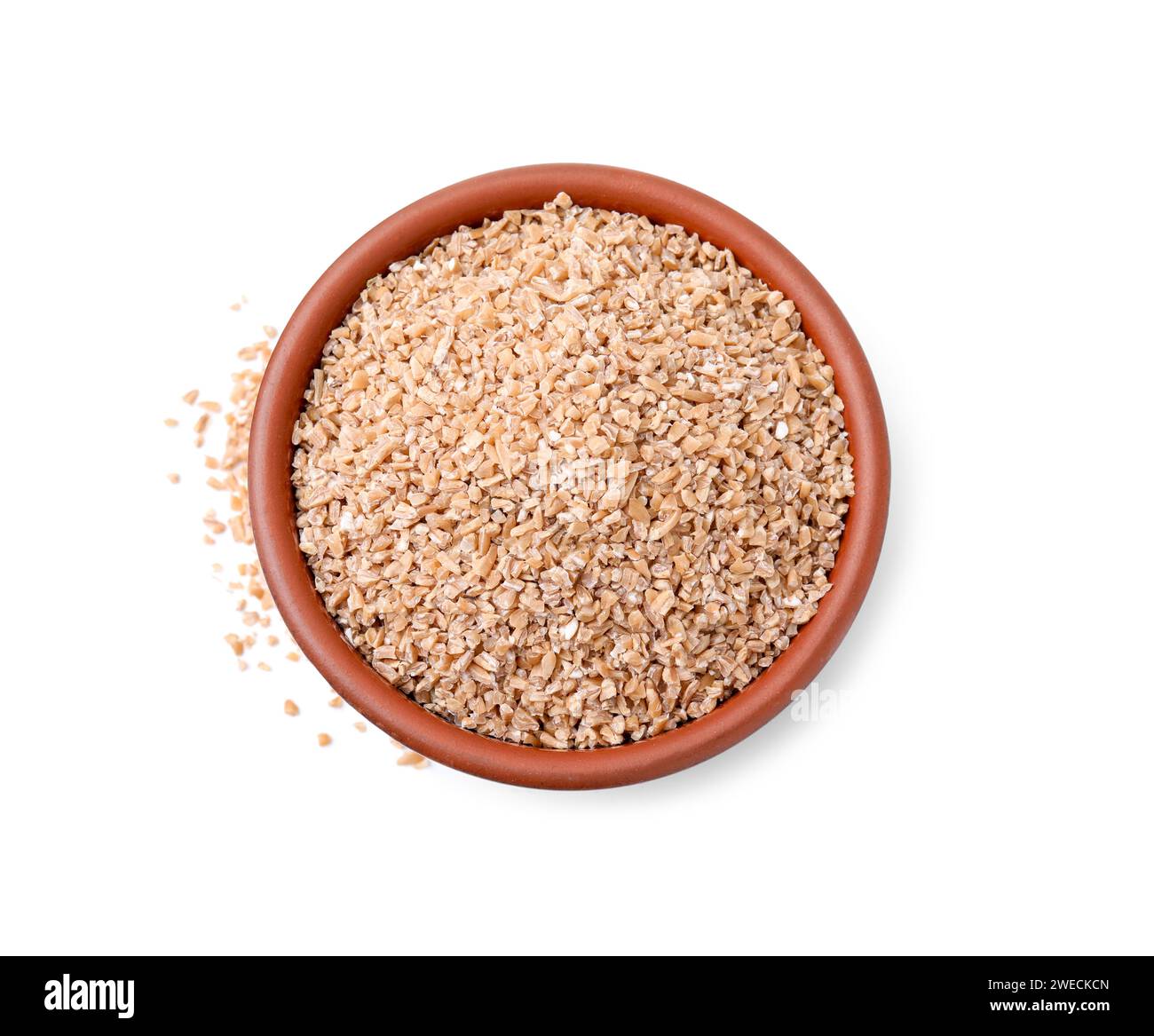 Dry wheat groats in bowl isolated on white, top view Stock Photo - Alamy