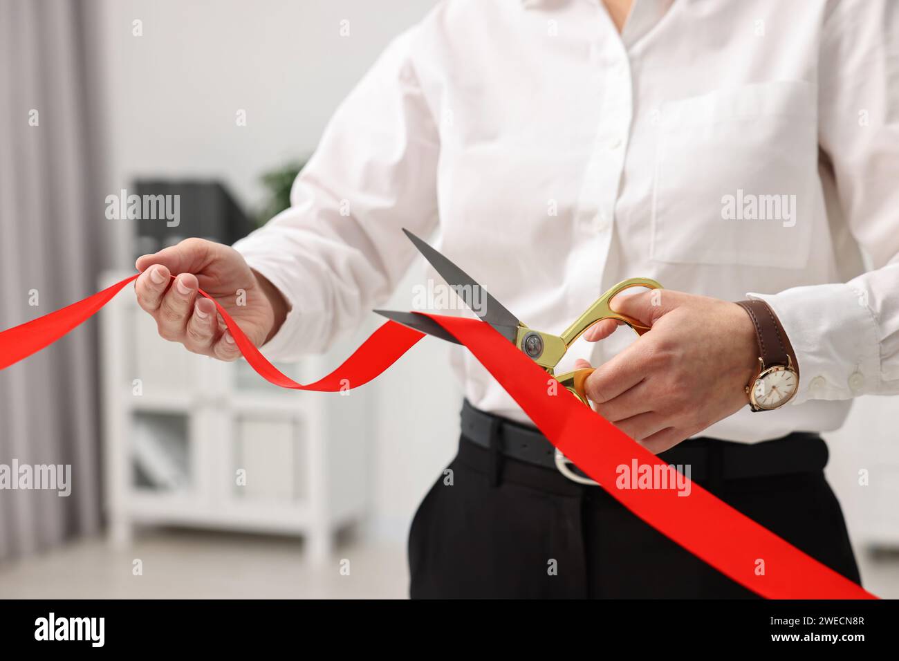 Woman cut red ribbon hi-res stock photography and images - Alamy