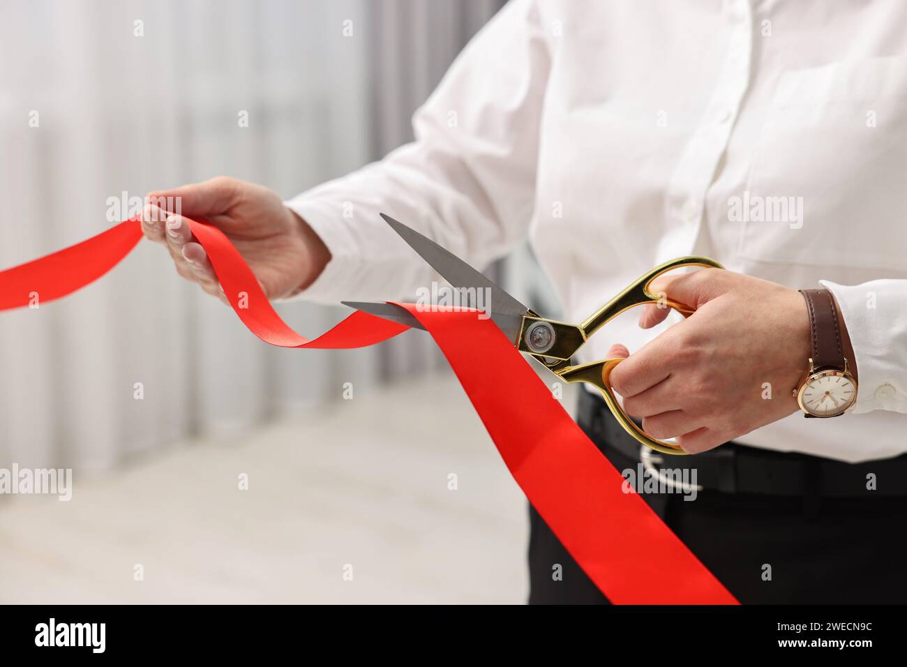 Woman cut red ribbon hi-res stock photography and images - Alamy