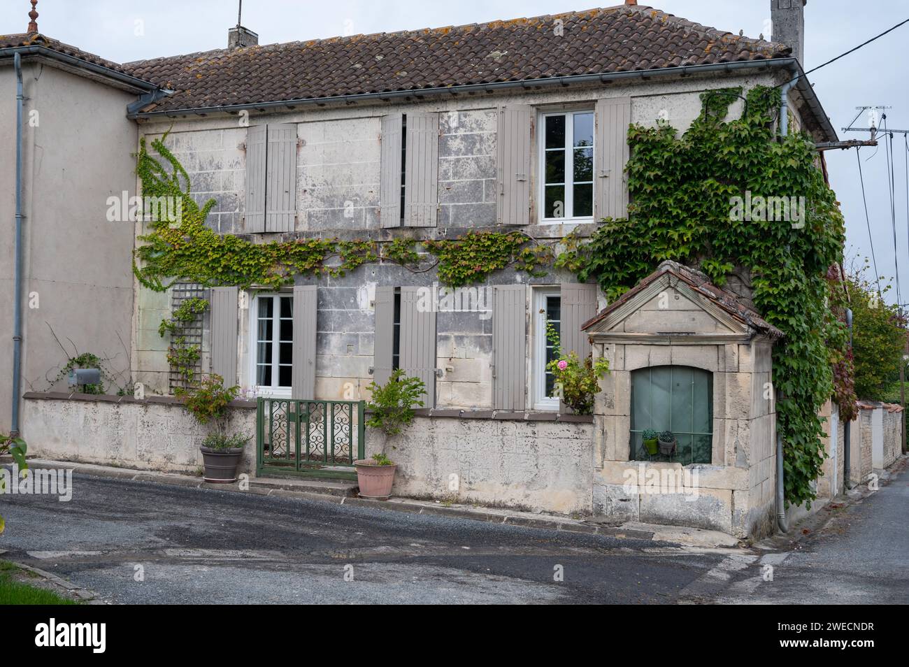 View on old streets and houses in Cognac white wine region, Charente ...