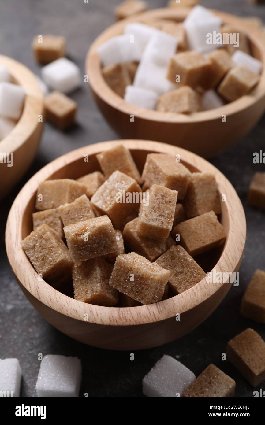 Different types of sugar in bowls on table, closeup Stock Photo - Alamy