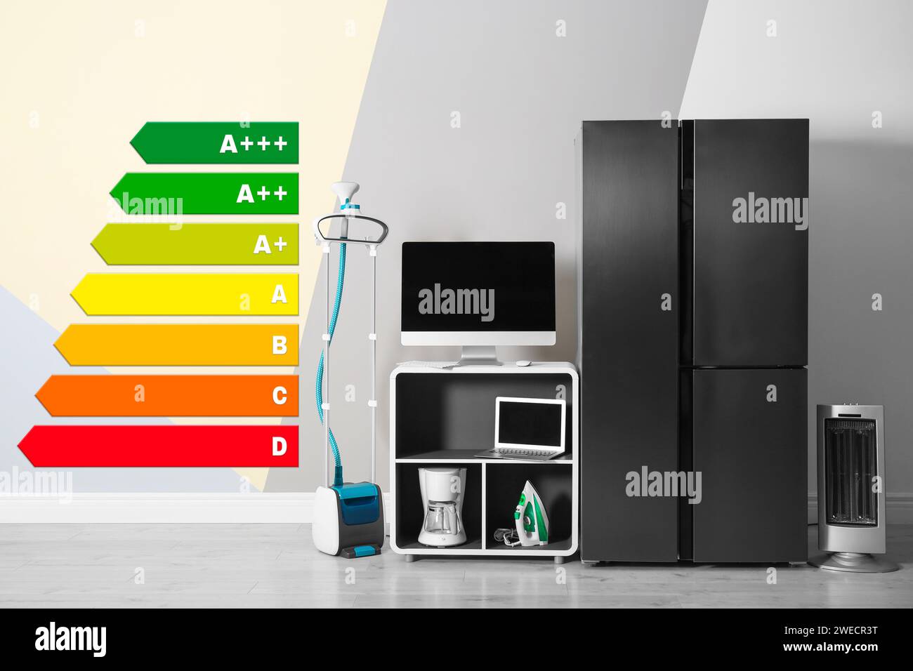Energy efficiency rating label and different household appliances near ...