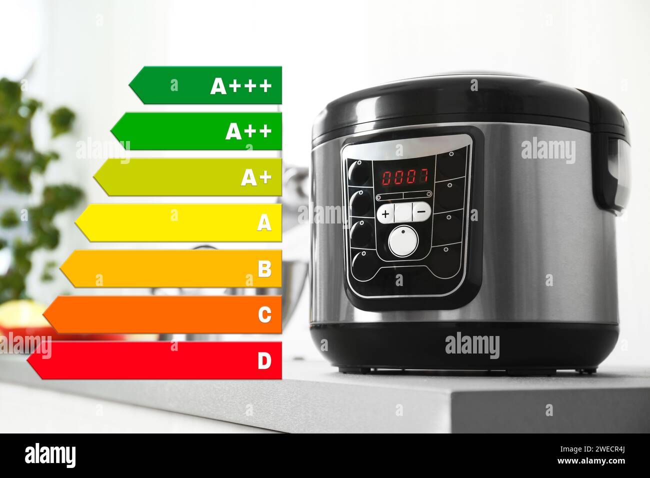 Energy efficiency rating label and multi cooker on table indoors Stock ...