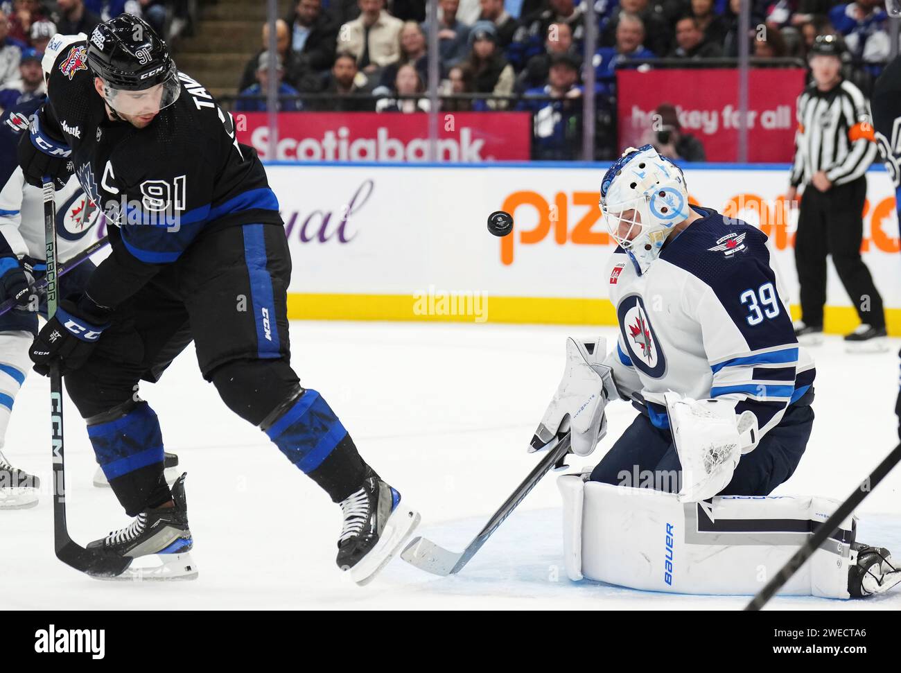 Winnipeg Jets goaltender Laurent Brossoit (39) makes a save on Toronto ...