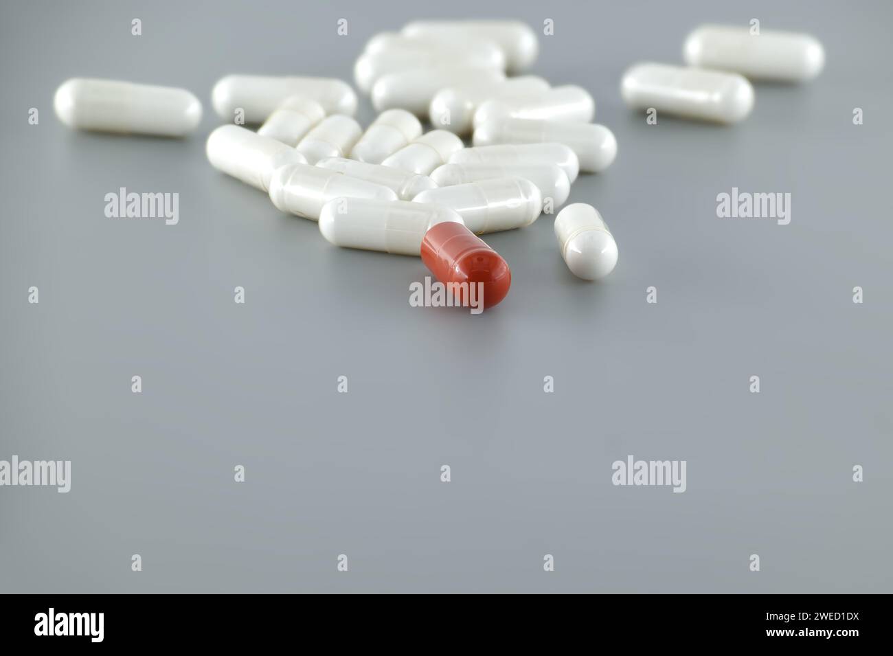 Minimal medical, pharmaceutical concept with white pills scattered on ...