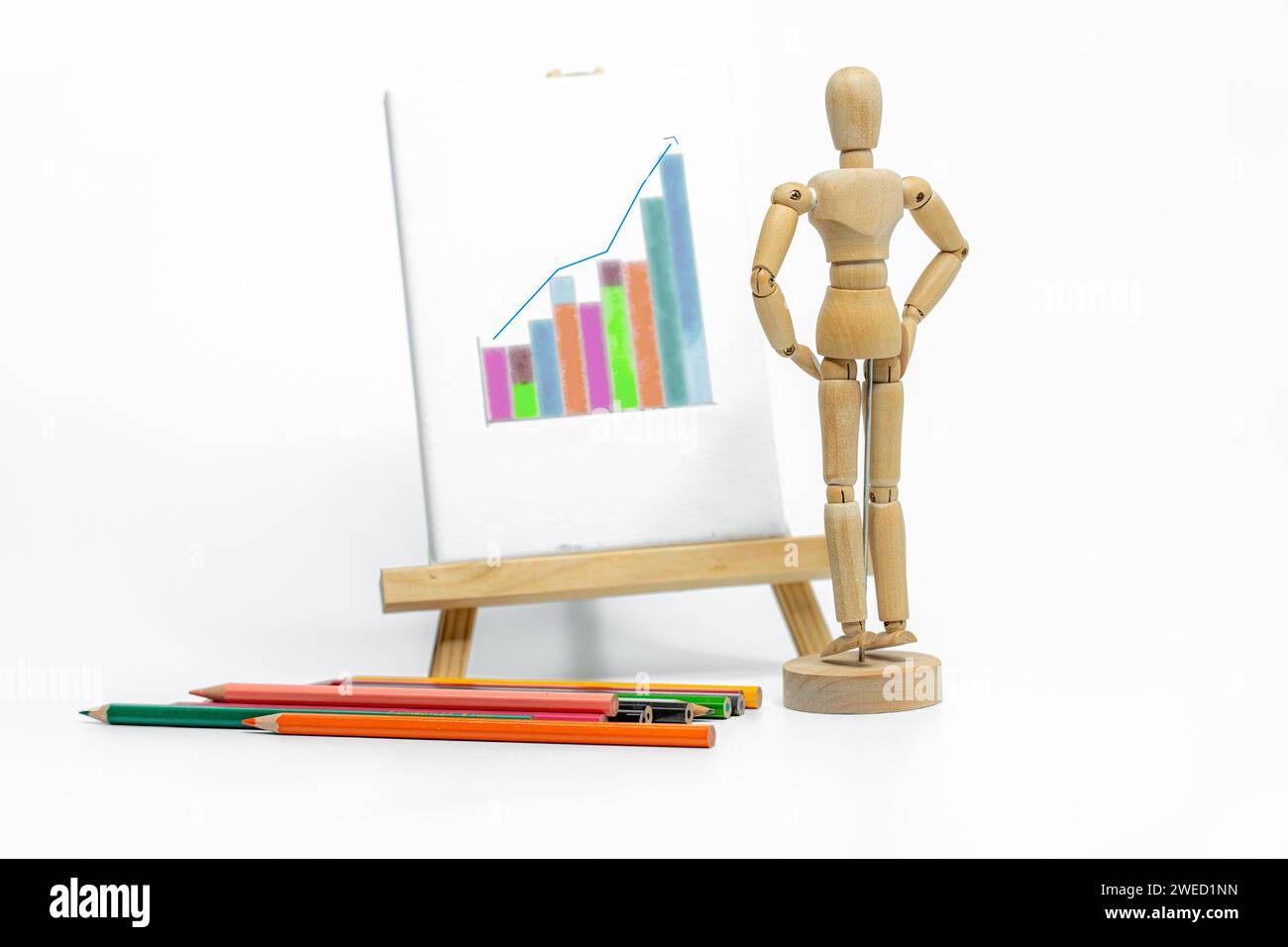 Mannequin drawing a graph charts on easel; isolated on white background ...