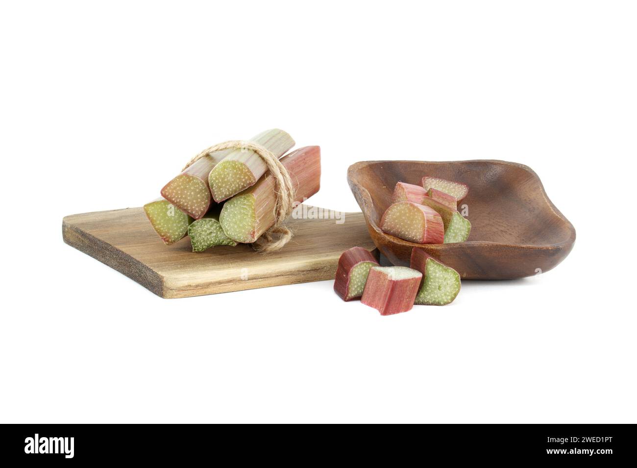 Rhubarb stalks tied together with a string isolated on white background ...