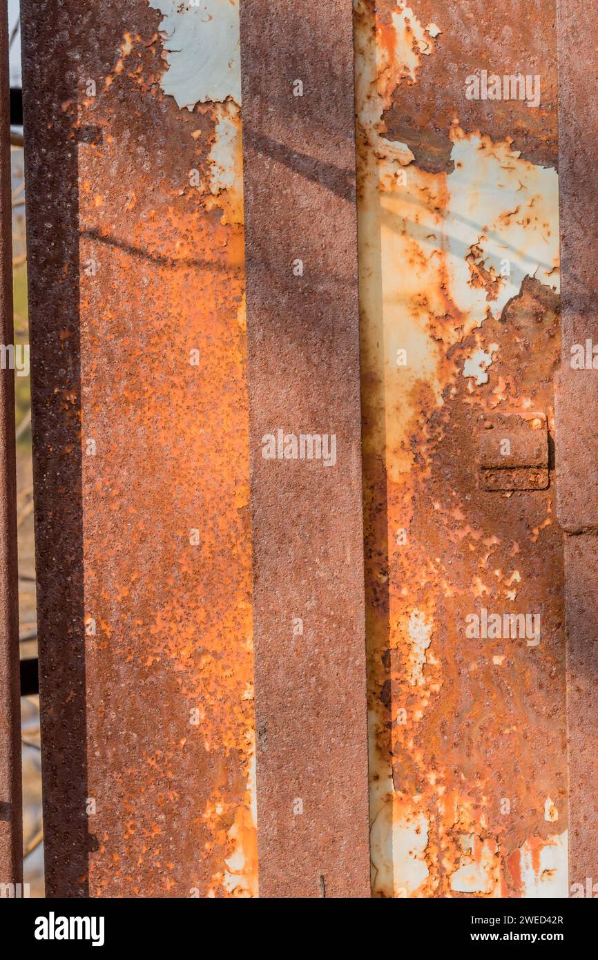 Side view of old electrical switch box inside rusty metal utility box ...