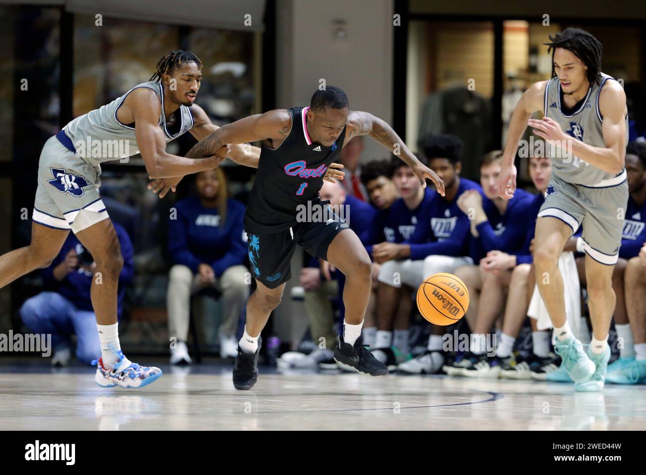 Rice guard Mekhi Mason, left, tries to hold Florida Atlantic guard ...