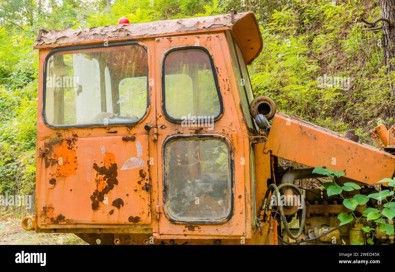 Left side cab section of old, rusting, broken down bulldozer abandoned ...