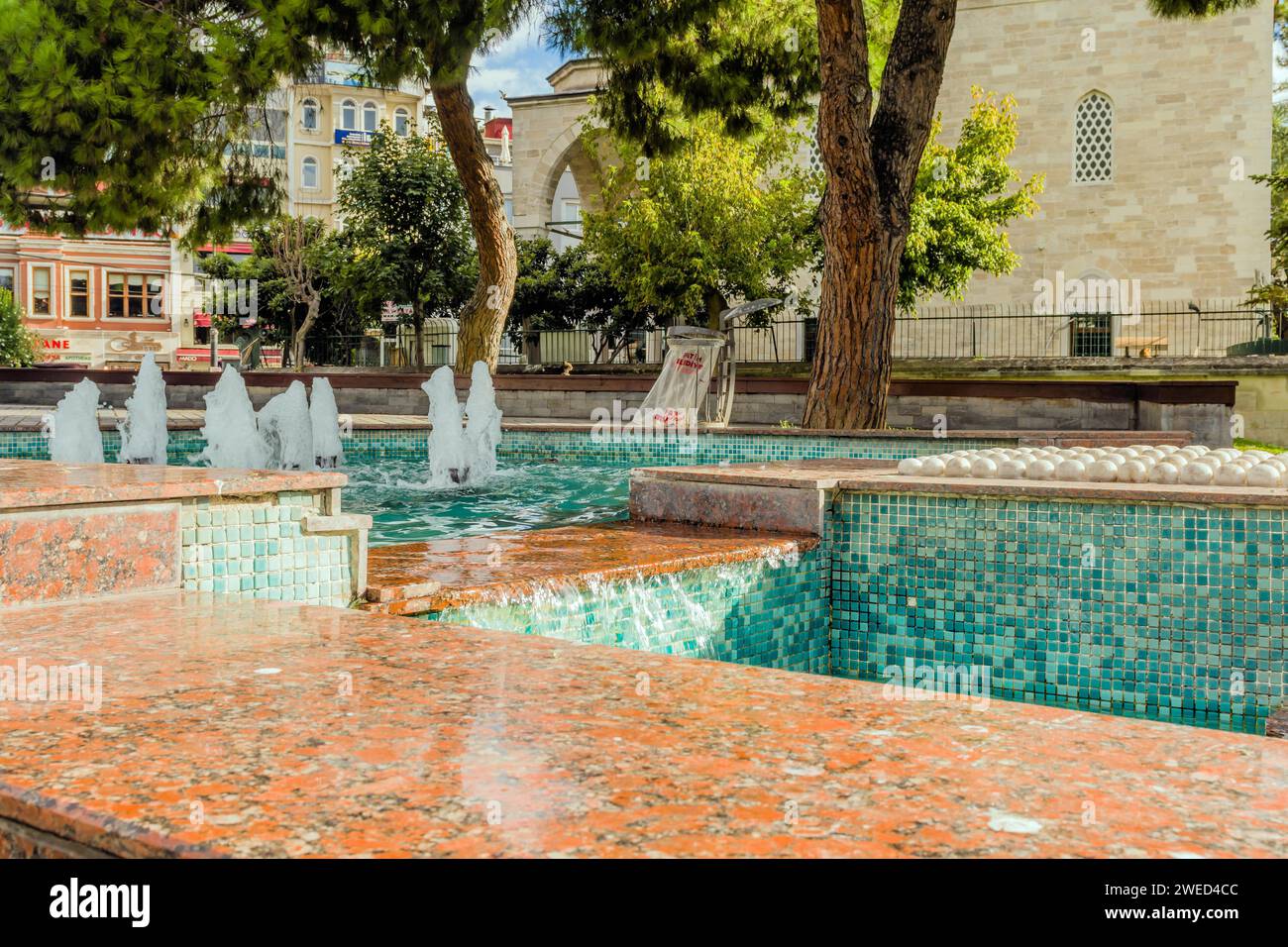 Water fountains in square shallow pool in Istanbul, Turkiye Stock Photo ...