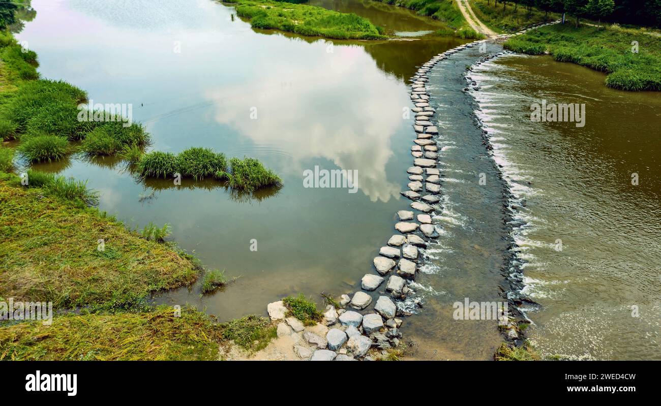 Aerial view of stone aeration footbridge across river in South Korea ...