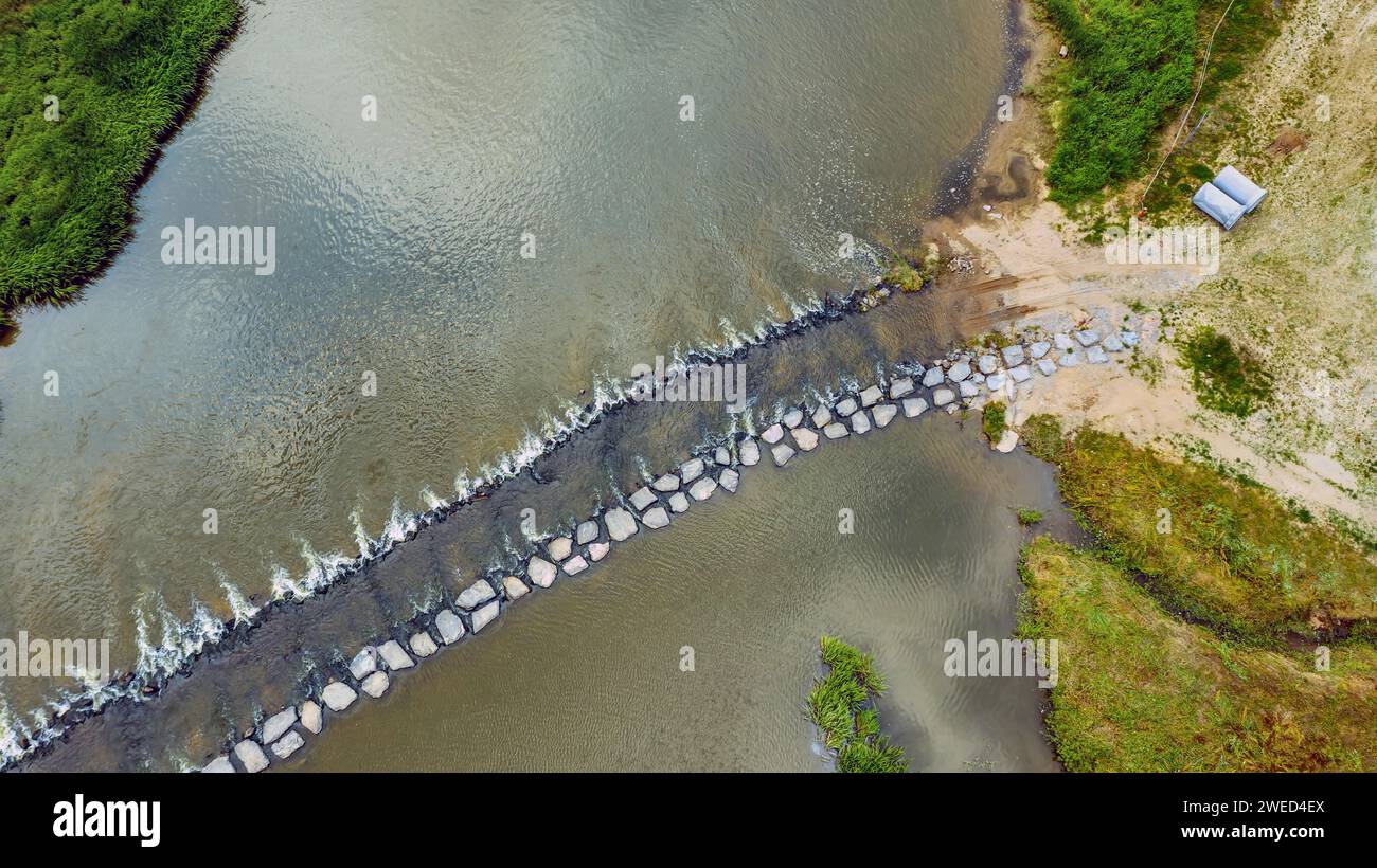 Aerial view of stone aeration footbridge across river in South Korea ...