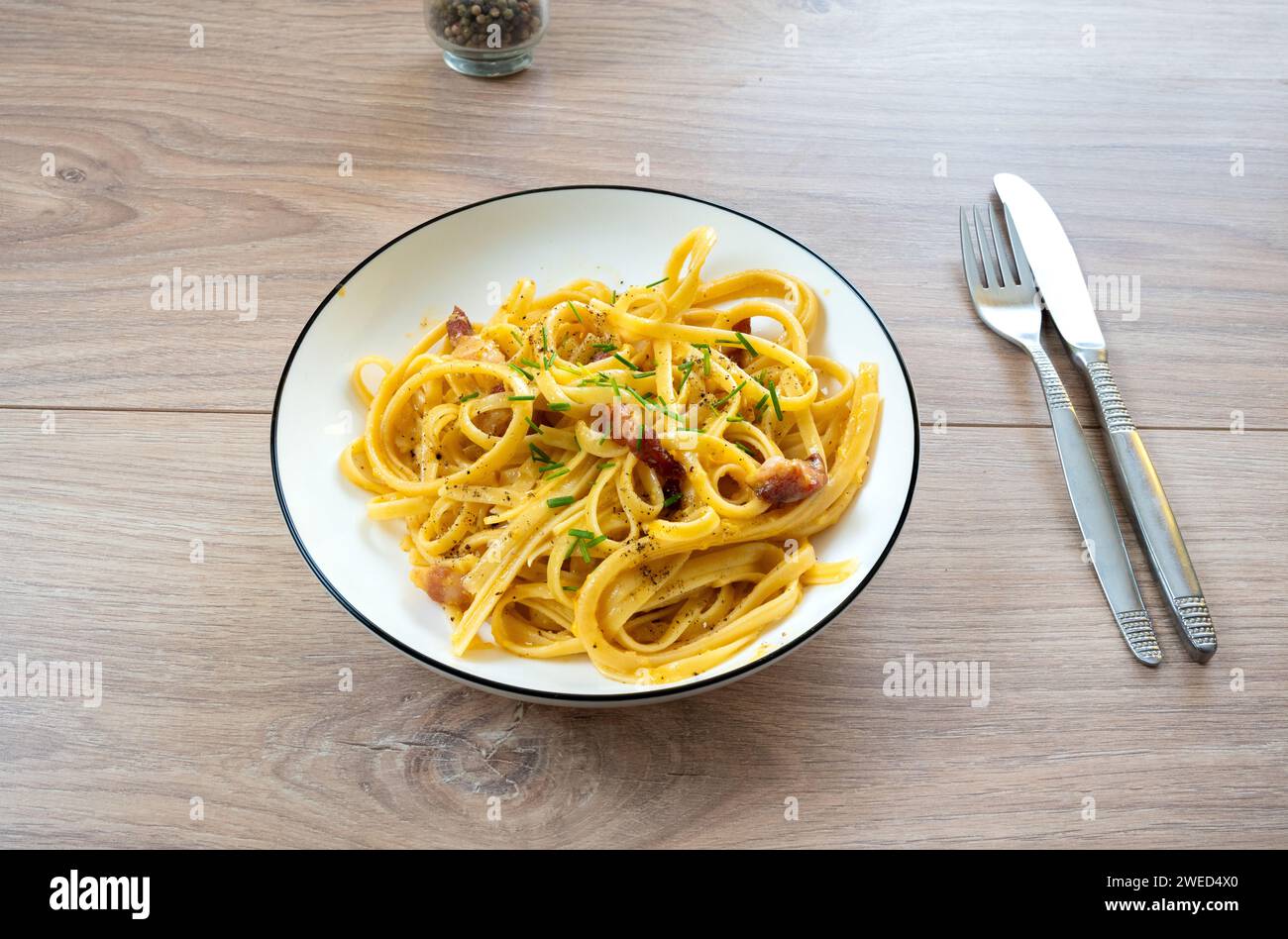 homemade pasta carbonara with parmesan and pepper, top view Stock Photo ...