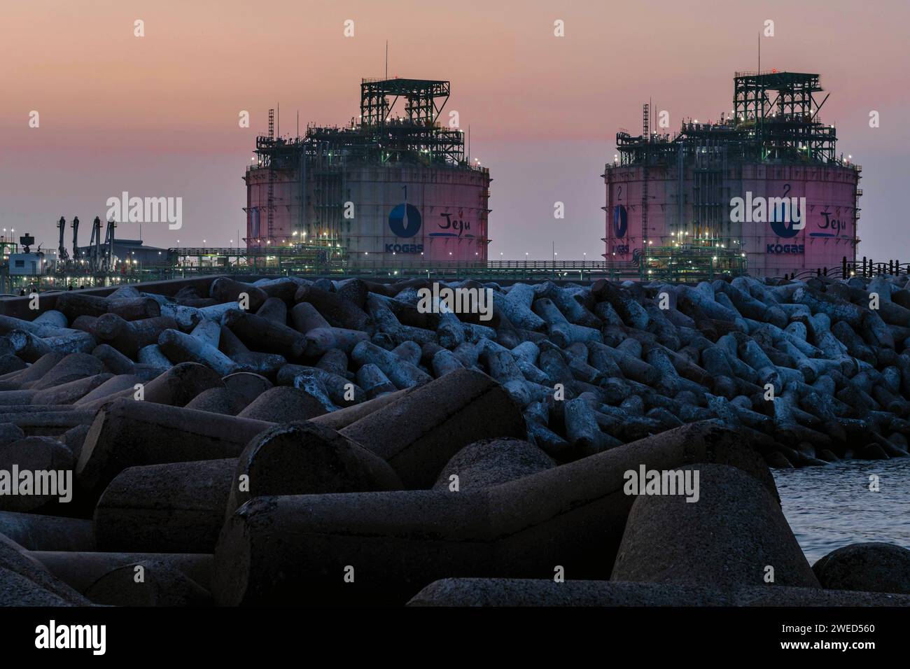 Two Korea gas storage tanks at sunset near harbor pier at sunset in ...
