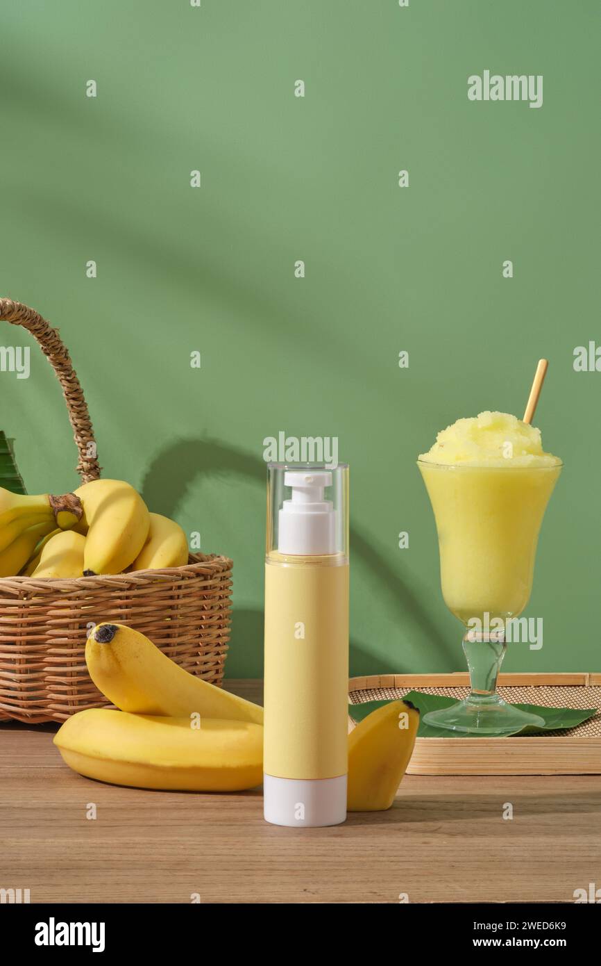 Pump bottle with empty label displayed with a glass of banana smoothie ...