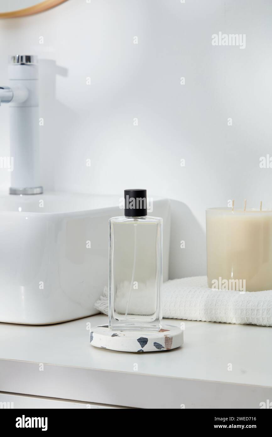 Bathroom concept with an unlabeled transparent bottle put on round ...