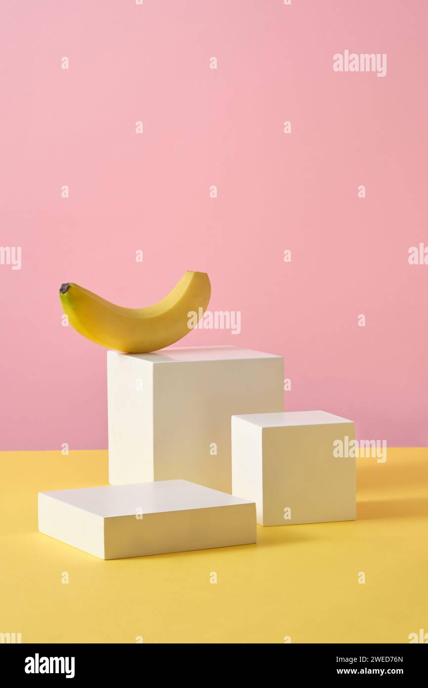Square-shaped podiums in different sizes are displayed with a banana ...