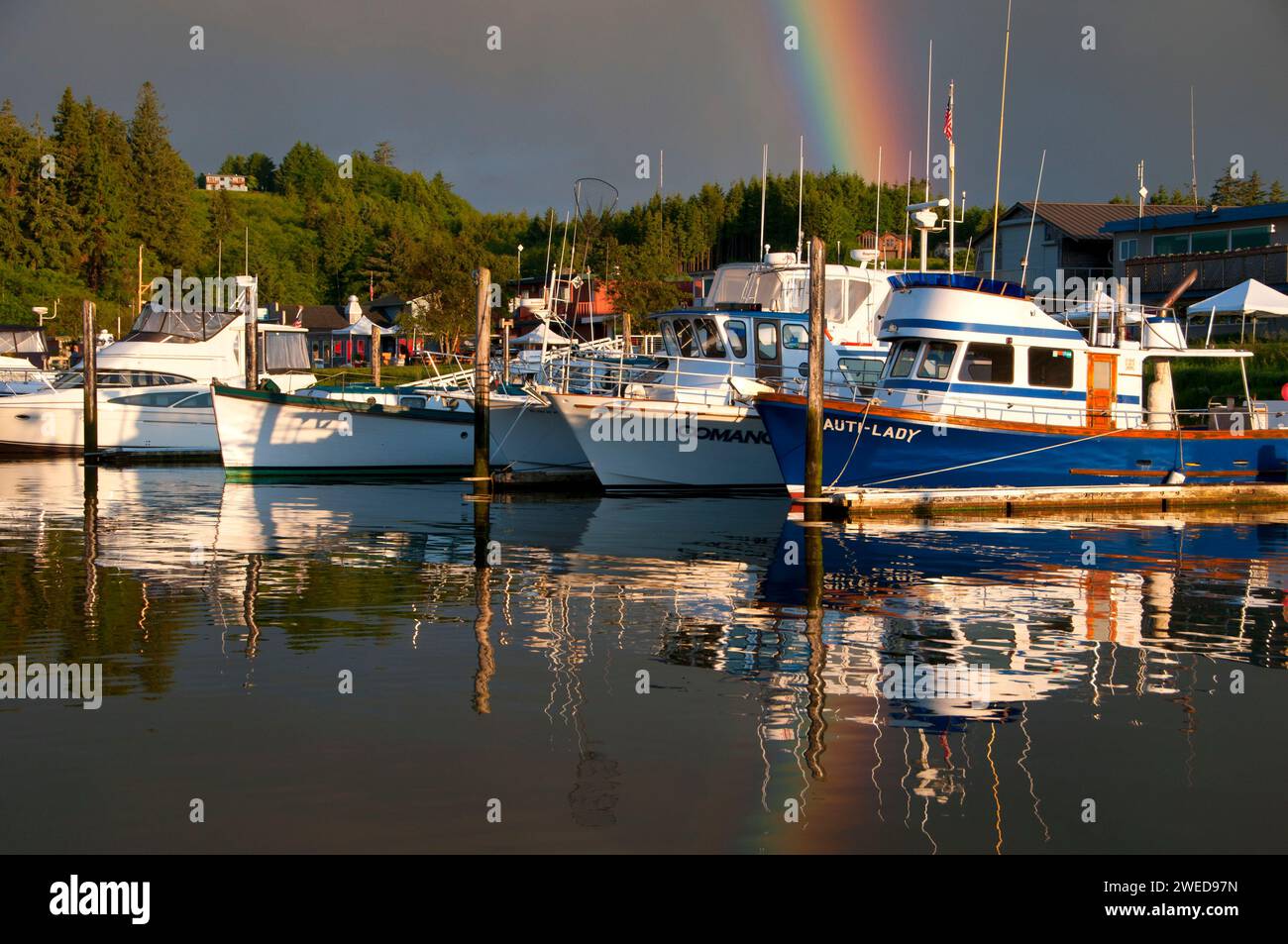 Fishing boats in harbor with rainbow, Ilwaco, Washington Stock Photo ...
