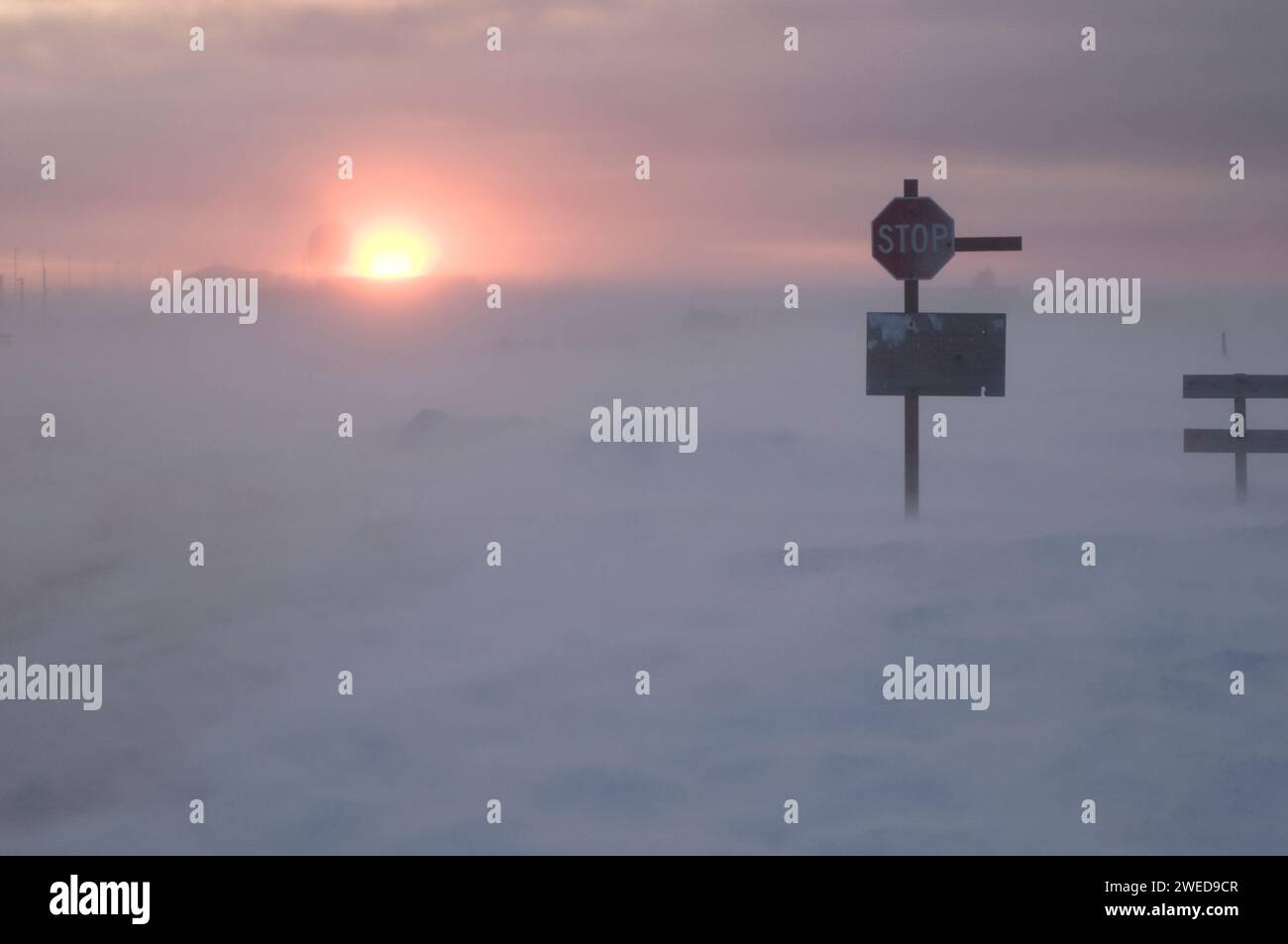 Sun sets as a blizzard freezes the landscape outside the Inupiaq ...