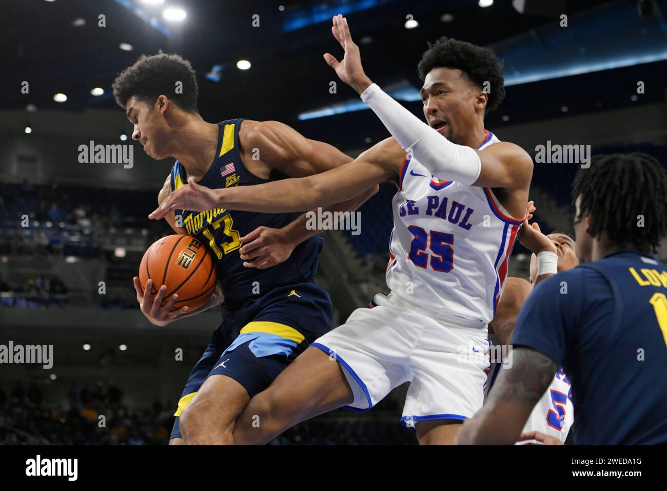 Marquette's Oso Ighodaro (13) battles DePaul's Jeremiah Oden (25) for a ...