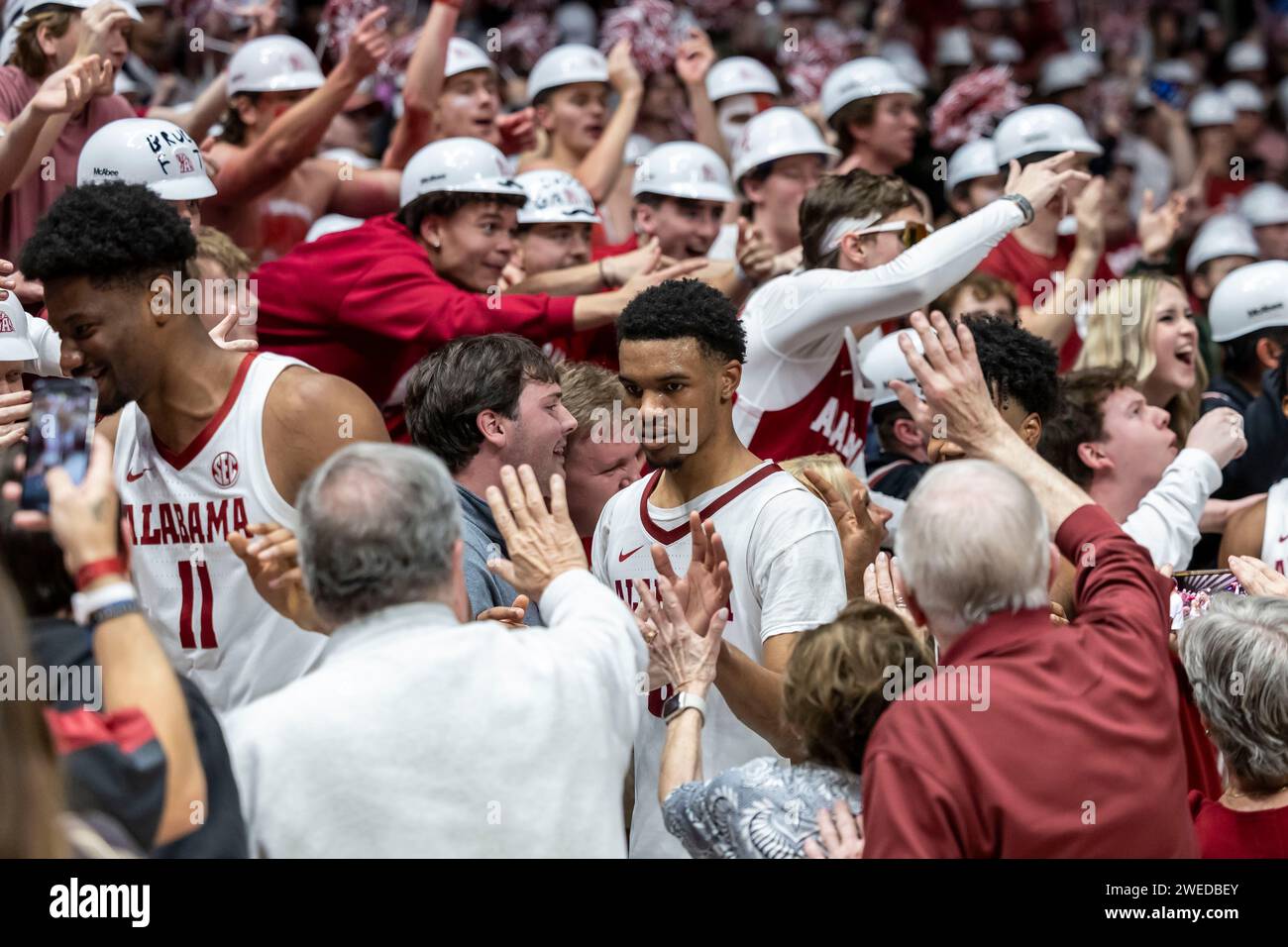 Alabama guard Rylan Griffen, center, is high-fived by fans after ...