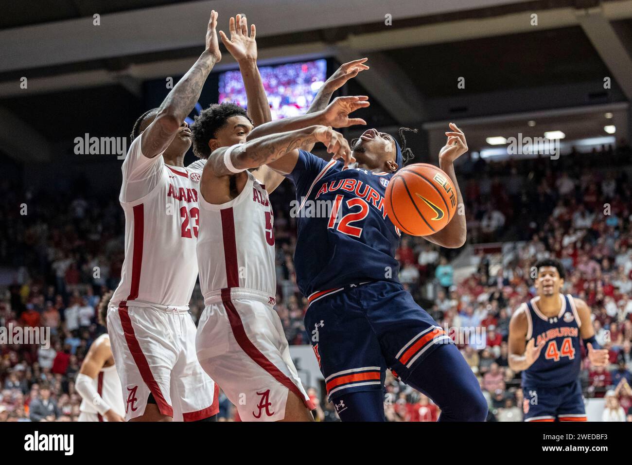 Auburn guard Denver Jones (12) collides with Alabama guard Aaron ...