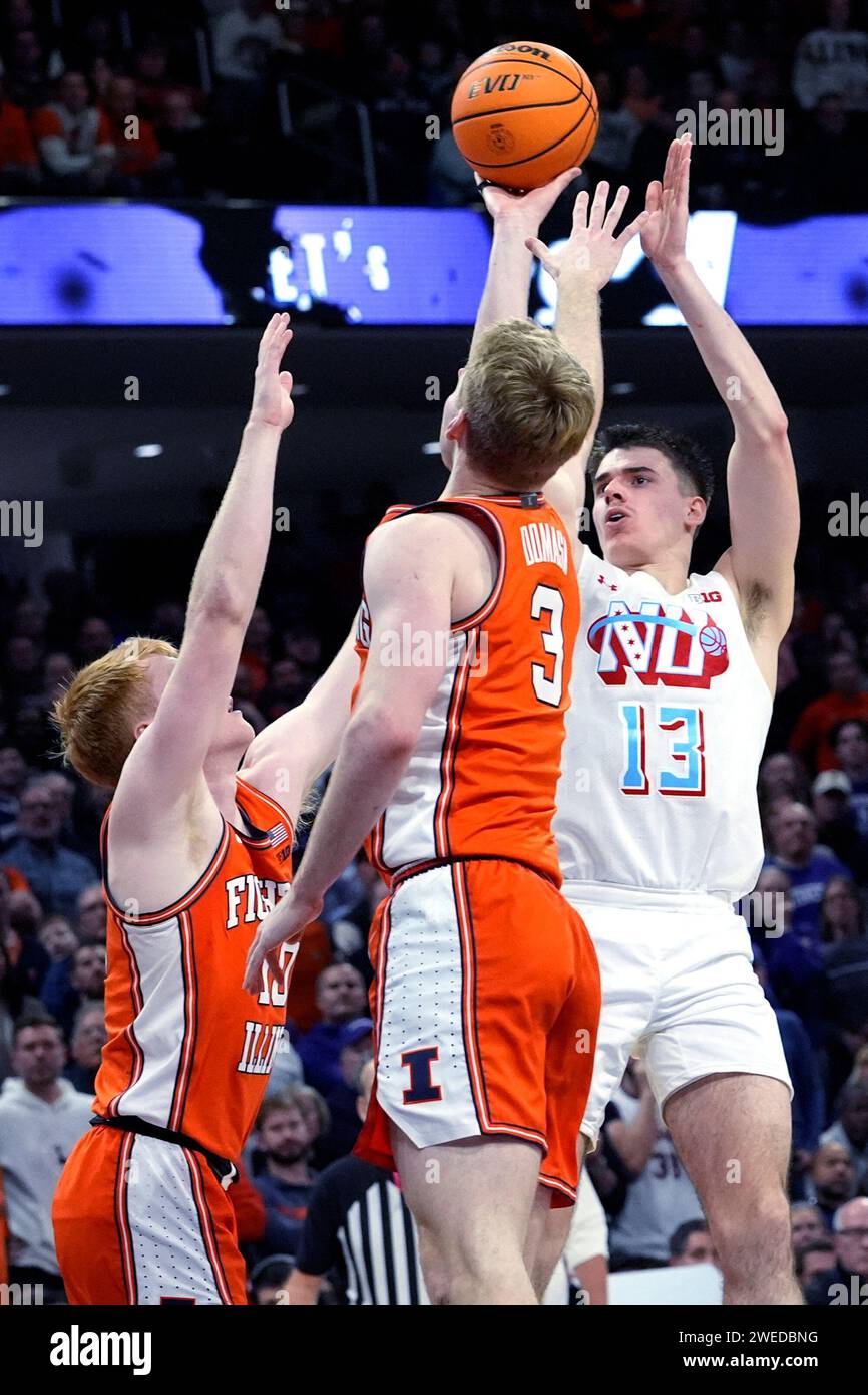 Northwestern guard Brooks Barnhizer, right, shoots over Illinois guard ...