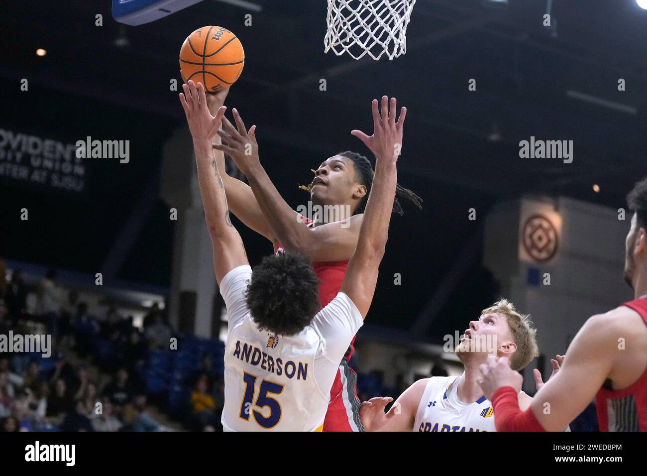 New Mexico forward JT Toppin shoots over San Jose State forward Trey ...