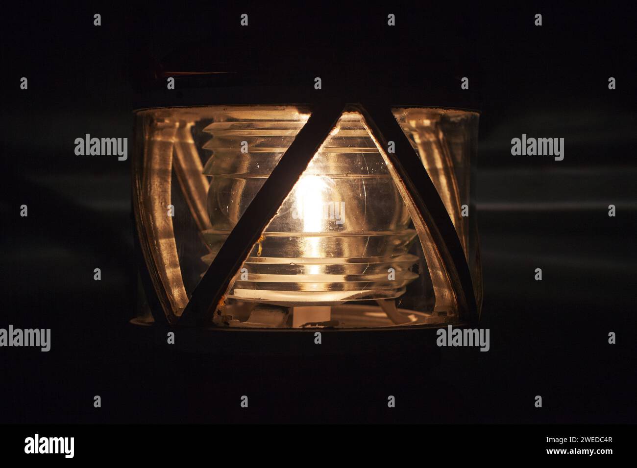 Vintage Lighthouse lamp in metal frame mounted on a top of a beacon ...