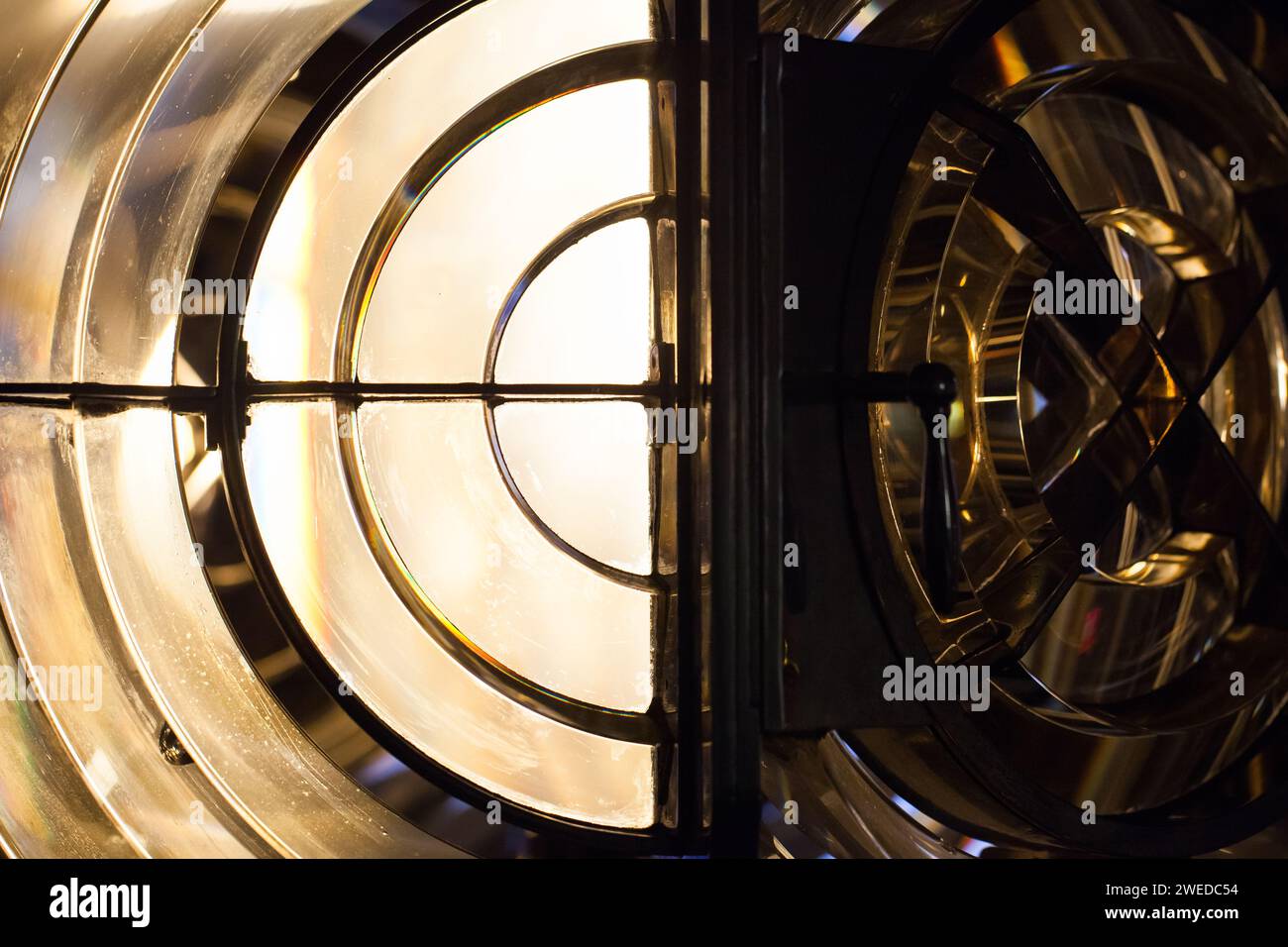 Close up photo of a lighthouse lamp with Fresnel lens mounted on metal ...