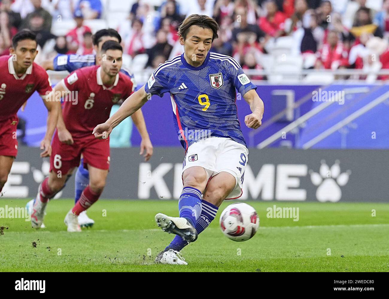 Ayase Ueda of Japan scores from a penalty spot in the first half of a ...