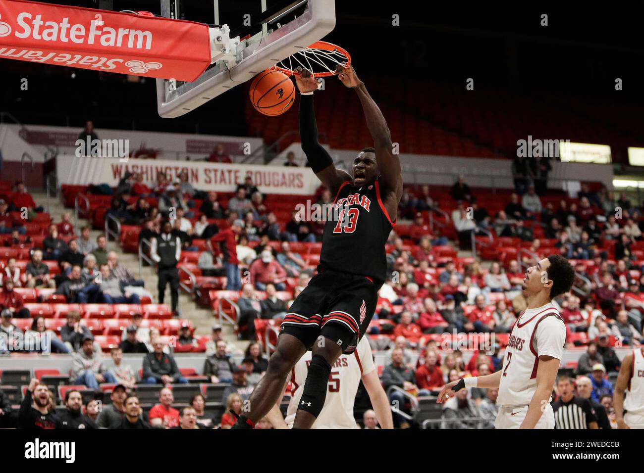 Utah center Keba Keita dunks against Washington State during the second ...