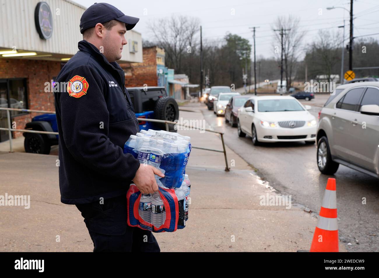 Fire Chief Charles Jenkins delivers bottled water to residents ...