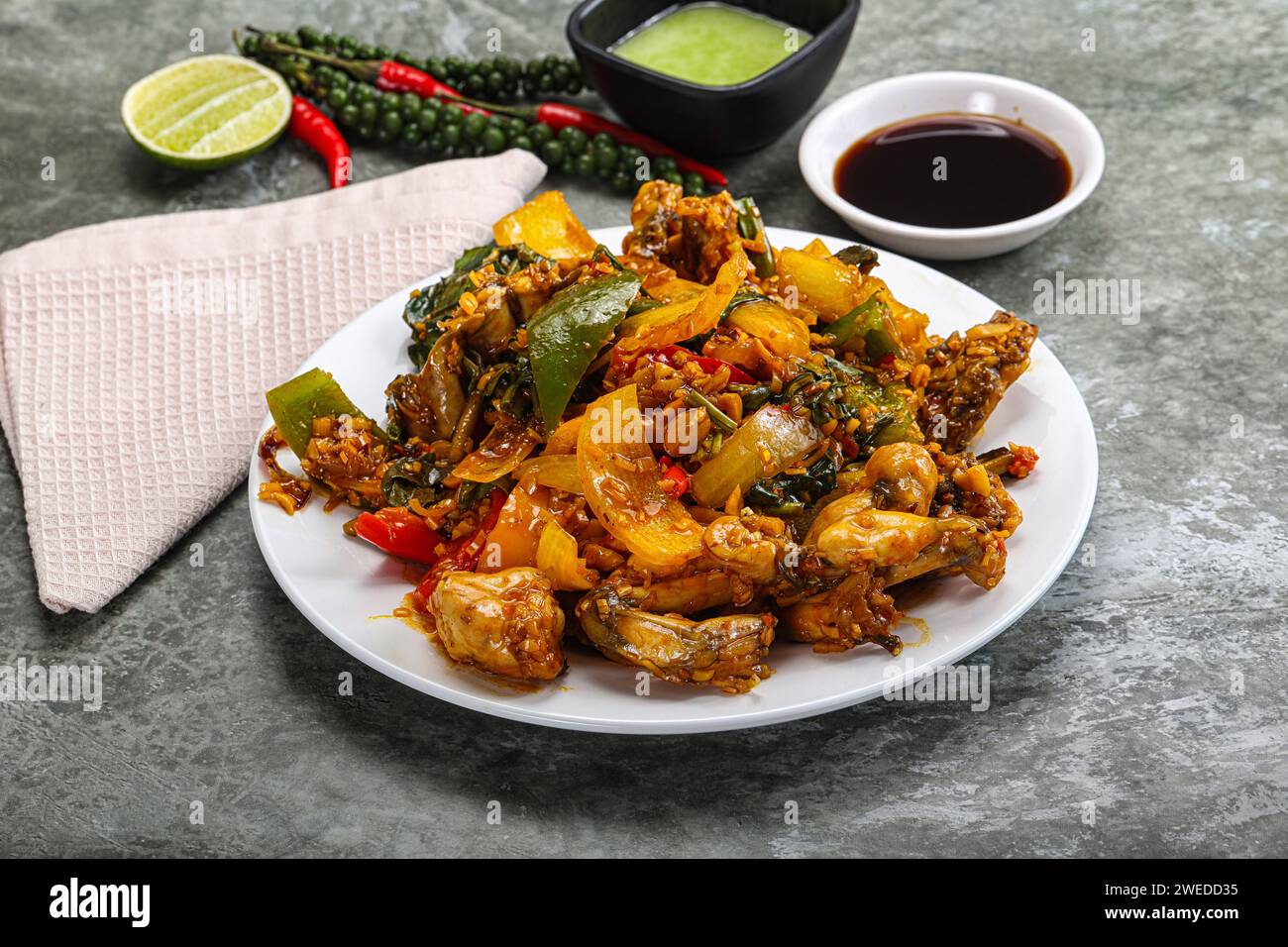 Vietnamese cuisine - fried frog with vegetables and spices Stock Photo ...