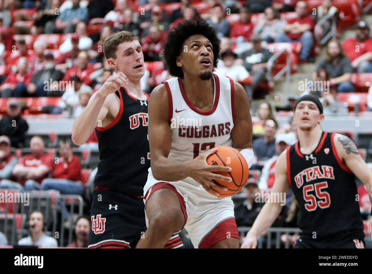 Washington State forward Isaac Jones eyes the basket, next to Utah ...