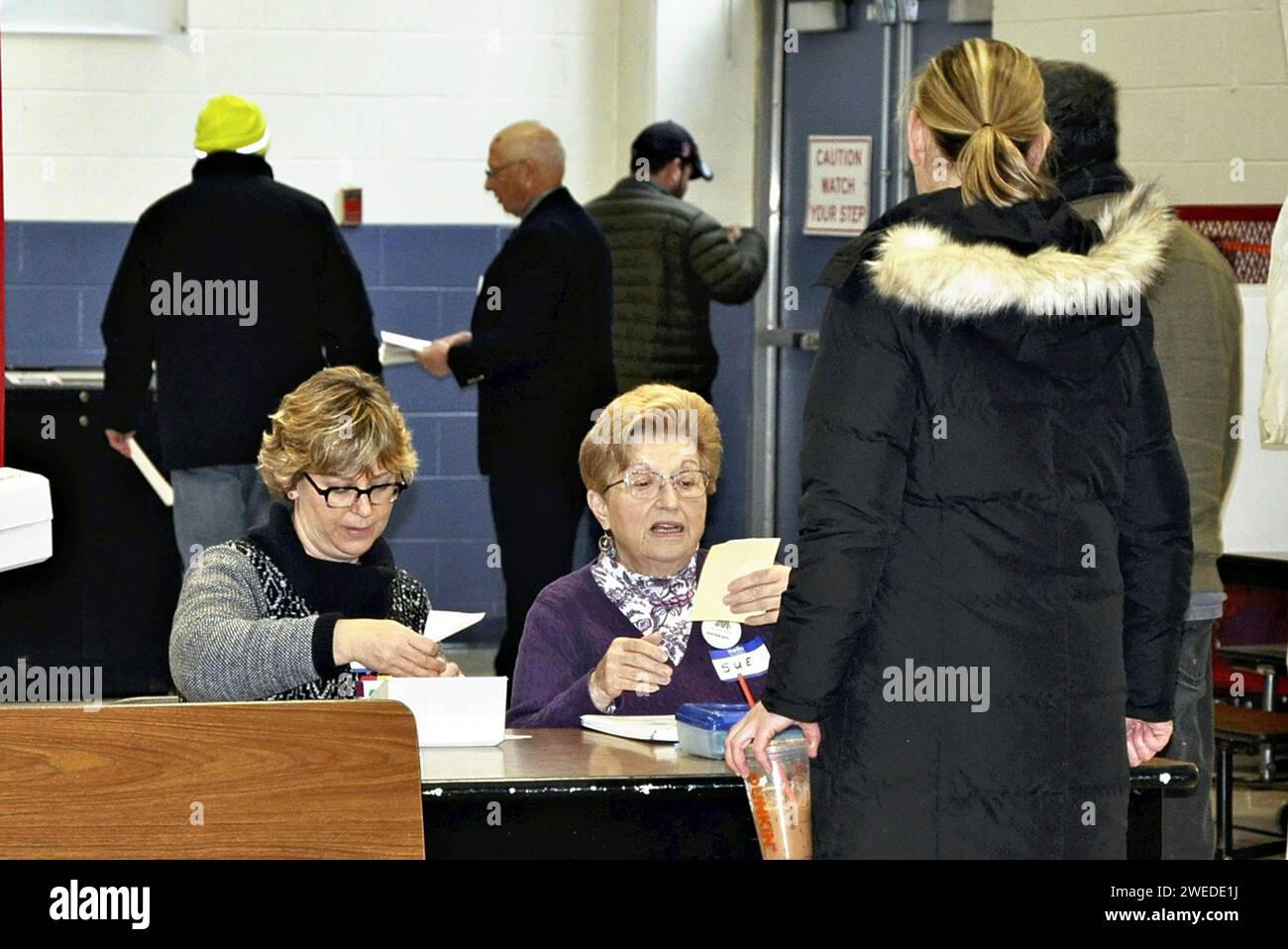 Voter receives ballot paper of New Hampshire's primary election in ...
