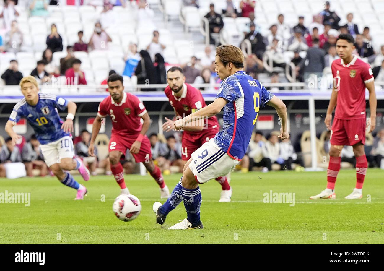 Ayase Ueda of Japan scores the opening goal from the penalty spot ...