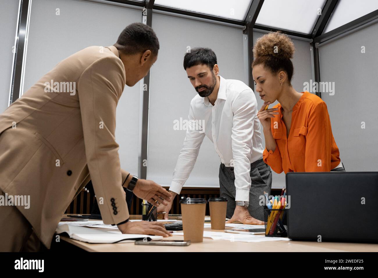 Discussing and sharing startup ideas at office workplace Stock Photo ...