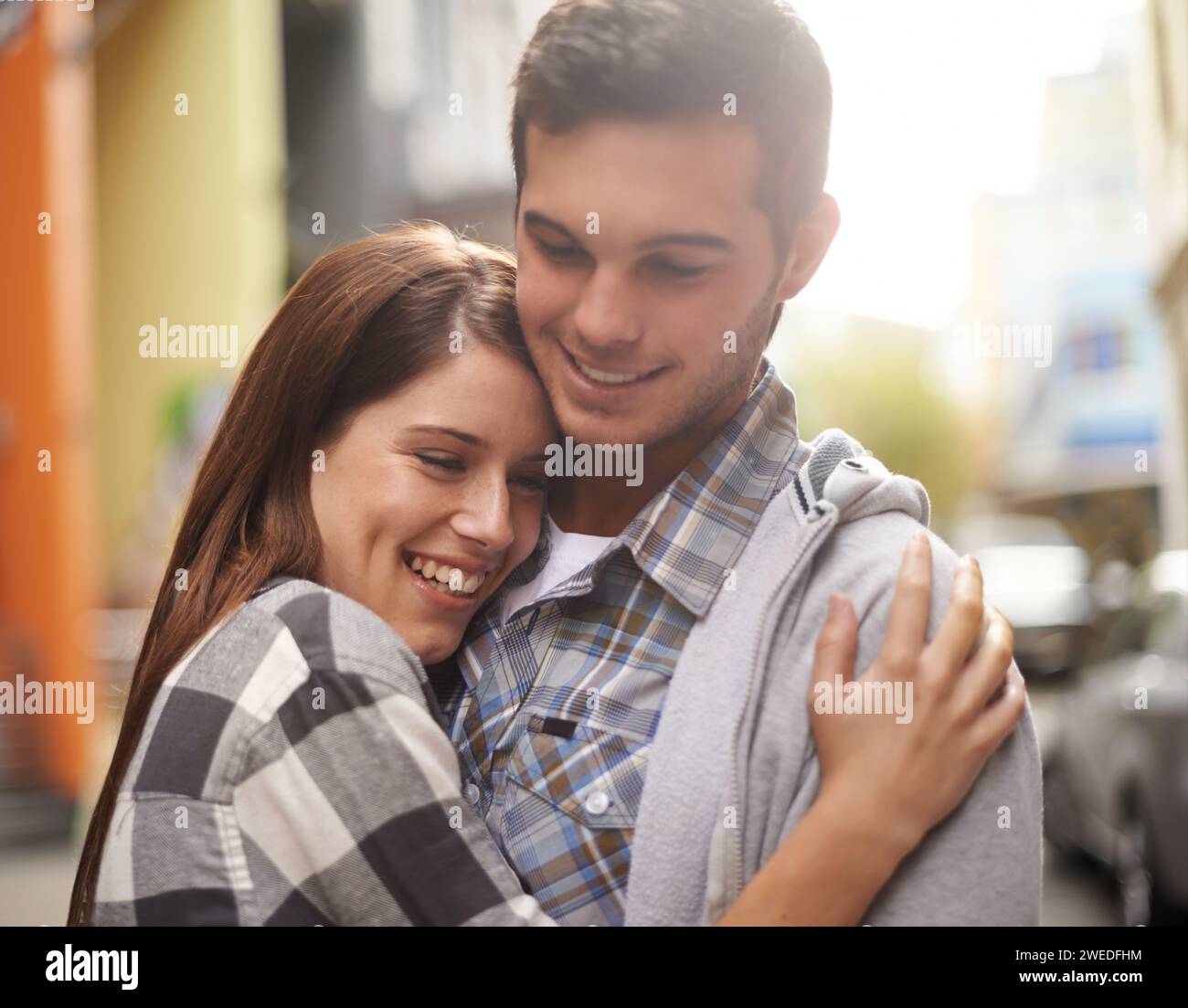 Love, happiness and couple hug together for security, comfort and enjoy ...