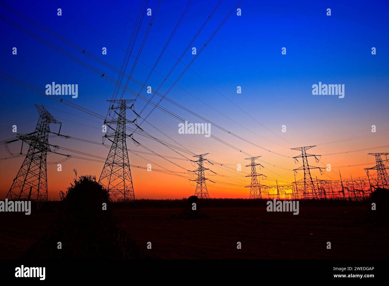 Sunset silhouette of pylon Stock Photo - Alamy
