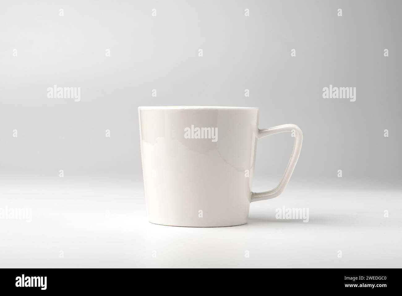 Blank white coffee mug mock up on white background Stock Photo - Alamy
