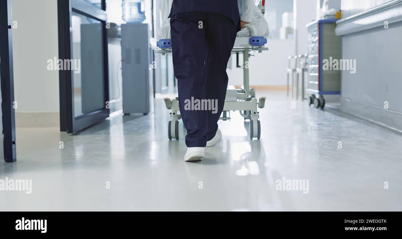 Nurse moving patient in bed hi-res stock photography and images - Alamy