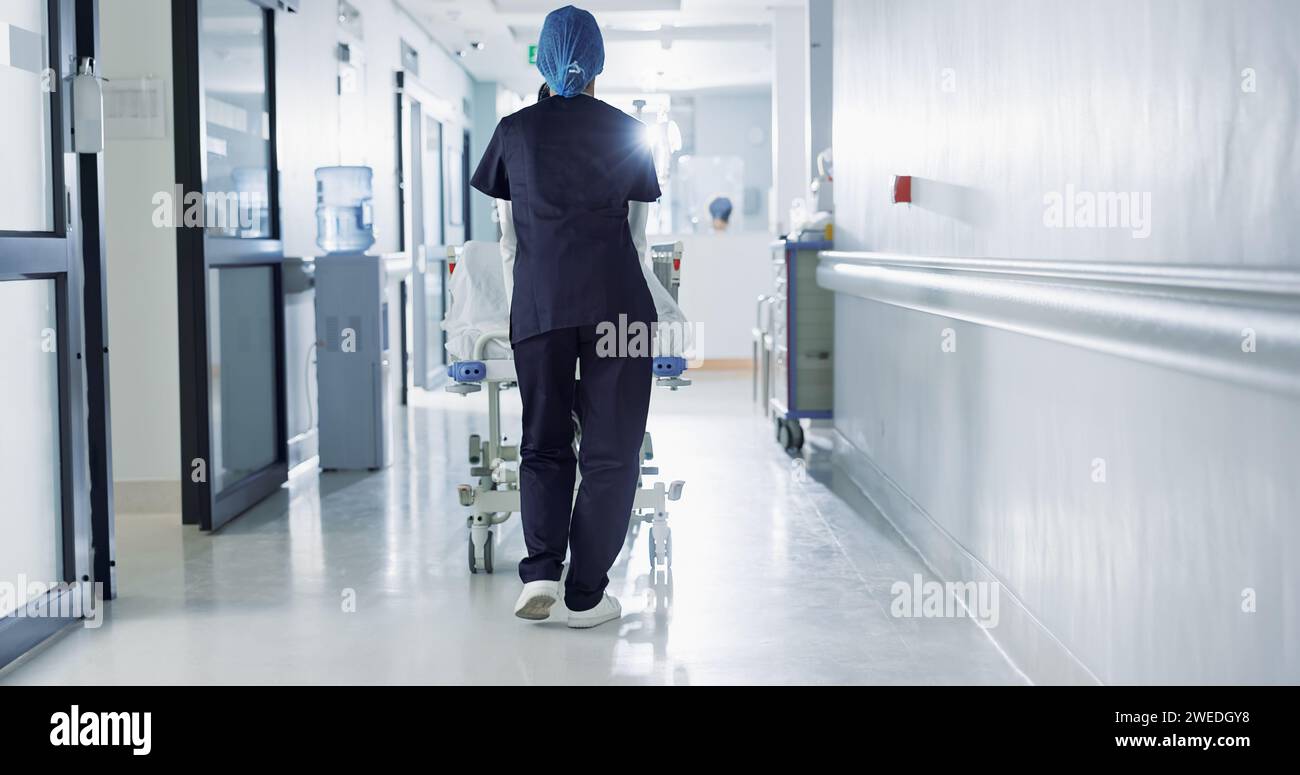Patient, bed and nurse walking in hospital, hallway or corridor to ...