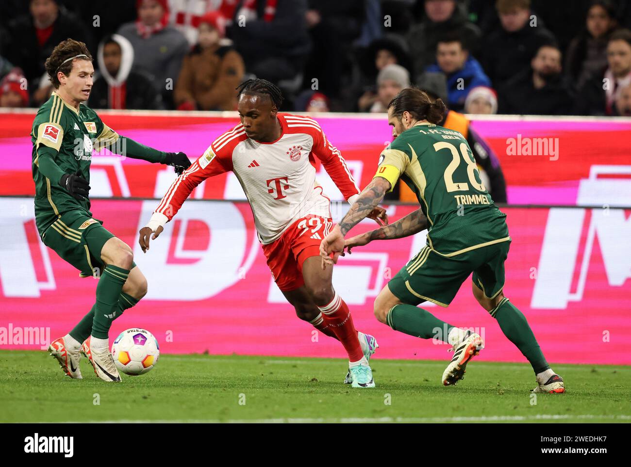 Mathys Tel of FC Bayern Muenchen Christopher Trimmel of FC Union Berlin ...
