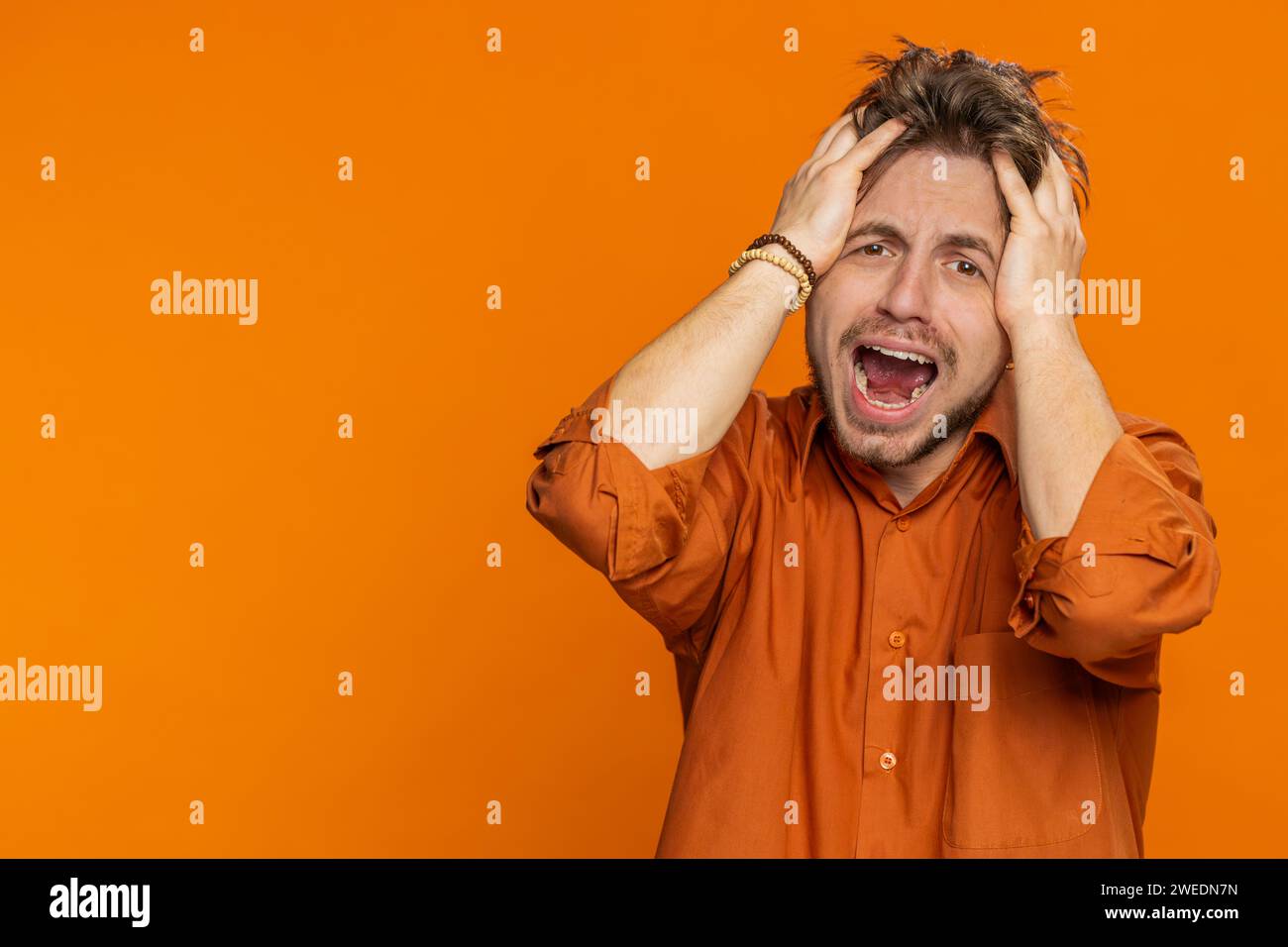 Irritated angry Caucasian man screams from stress tension problems ...